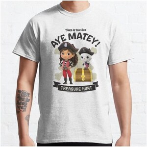ZOKAWEAR Tričko Baggy Fit Unisex Domček pre bábiky Gabby's Aye Matey! Design Hunt s pokladom ...
